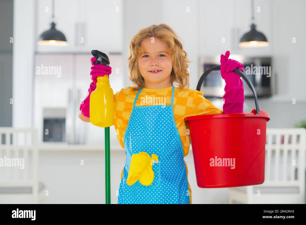 Cleaning at home. Portrait of child helping with housework, cleaning ...