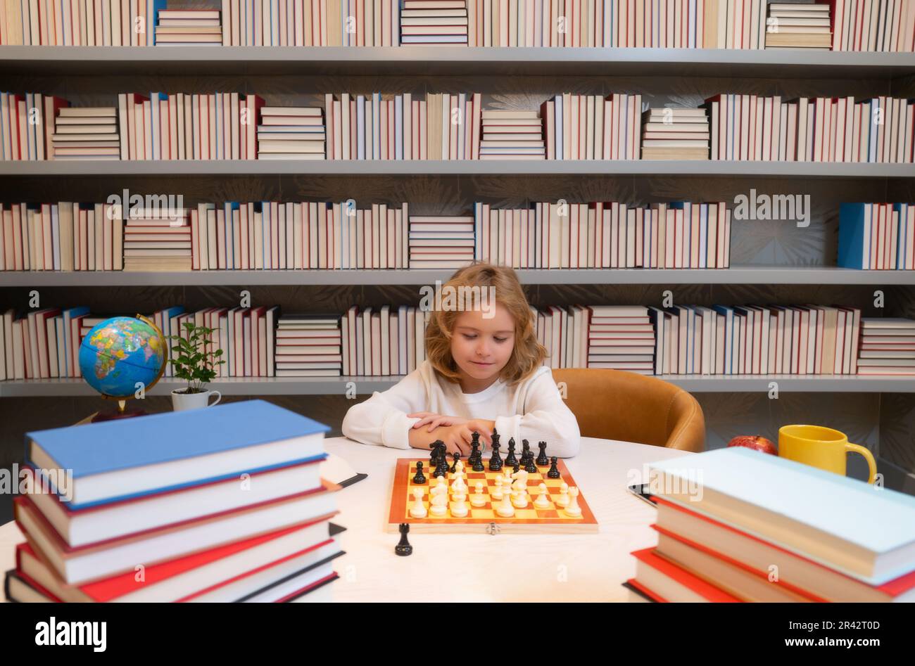 Schoolboy chessman thinker. Child playing chess. Clever kid thinking ...
