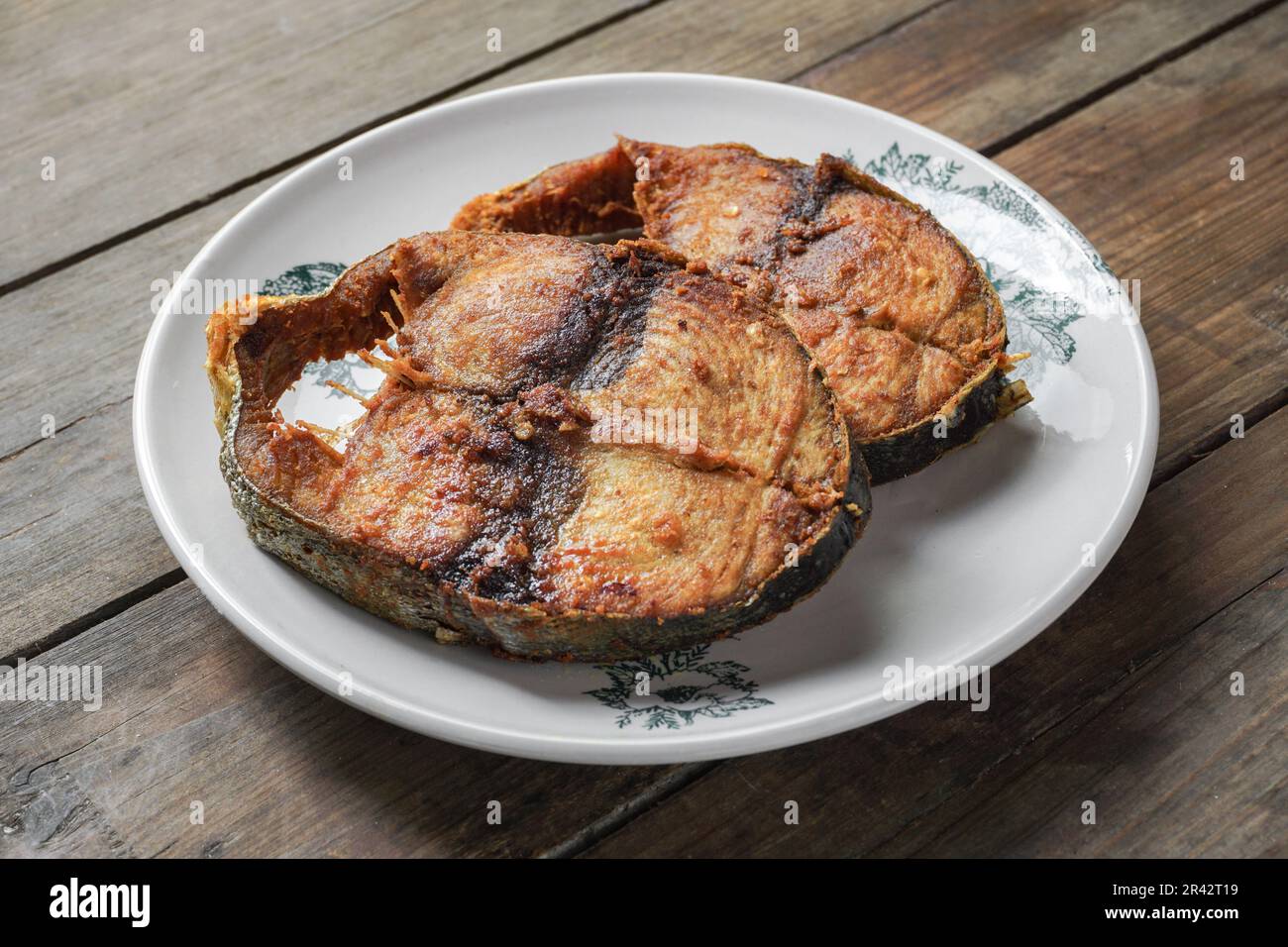 Ikan Tongkol goreng or fried Mackerel Tuna fish. Fried dry with ...