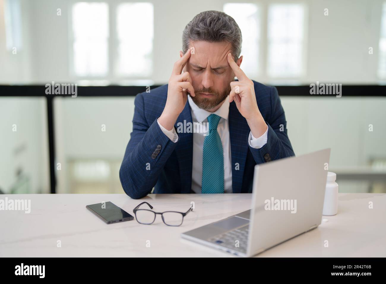 Overworked burnout man feeling migraine head strain. Tired bored ...