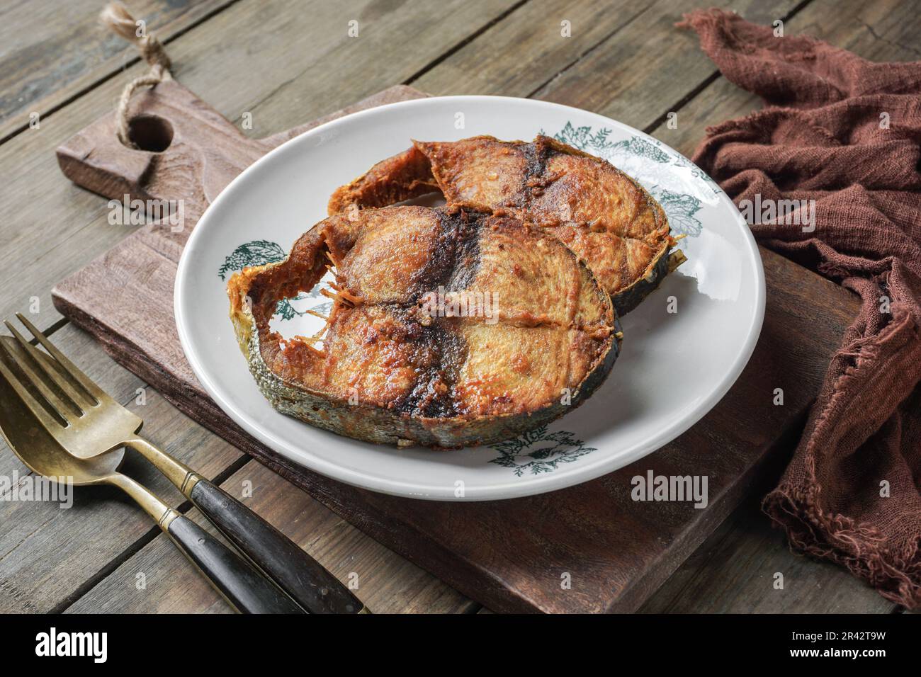 Ikan Tongkol goreng or fried Mackerel Tuna fish. Fried dry with ...