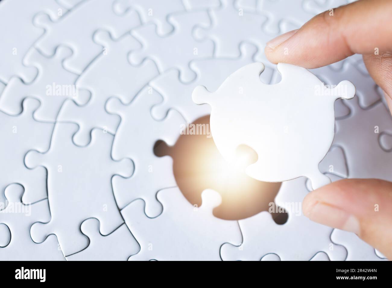 White jigsaw in the hands, The correct solution. Teamwork, Solving and ...