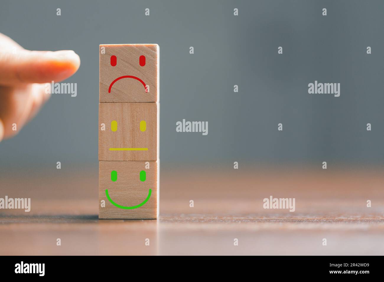 Rating feedback scale on wood cube with copy space. Service rating ...