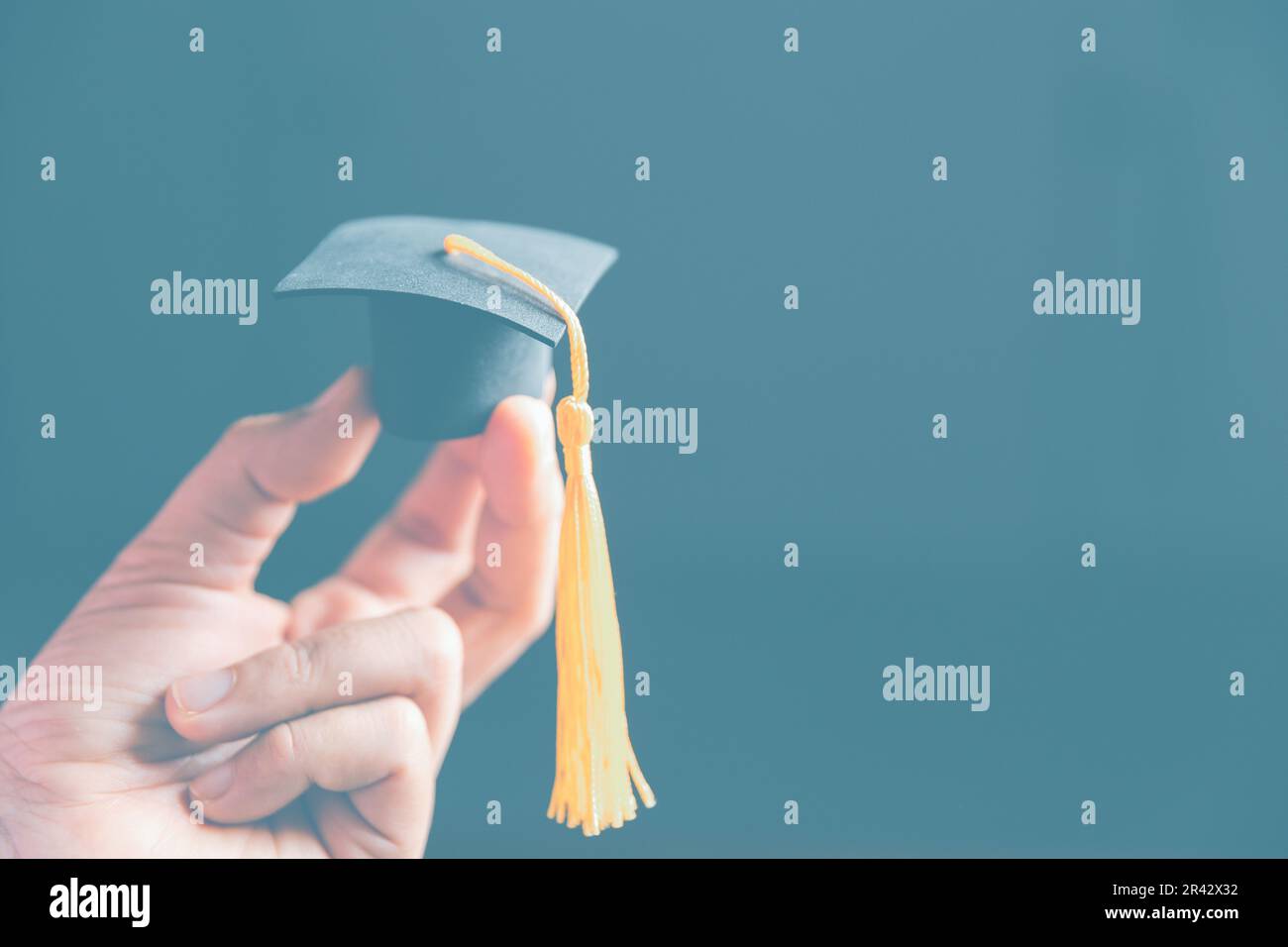 Female hand holding graduation cap. Concept of global business study ...