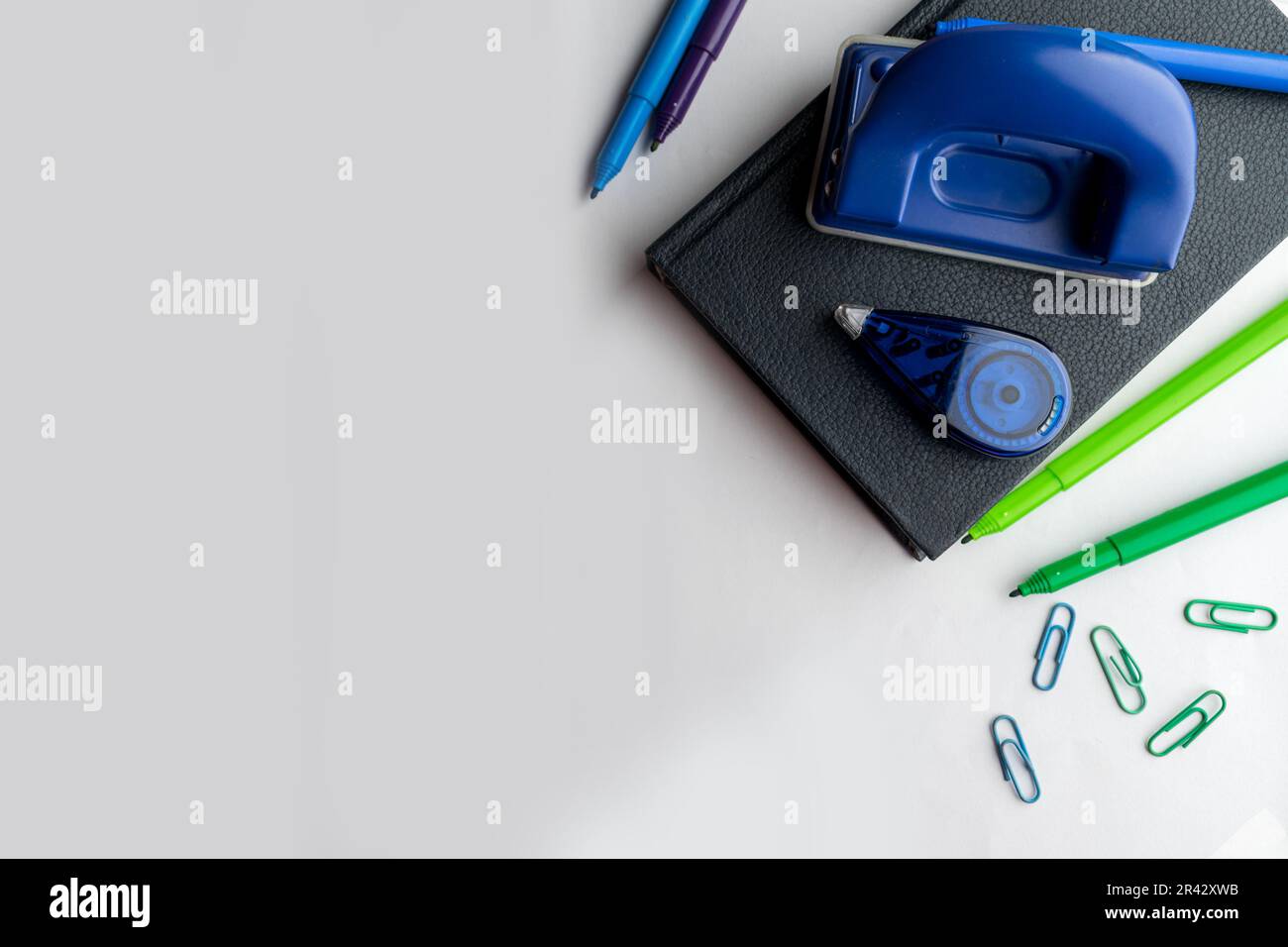 Flat lay design of office work desk with colorful stationery and ...