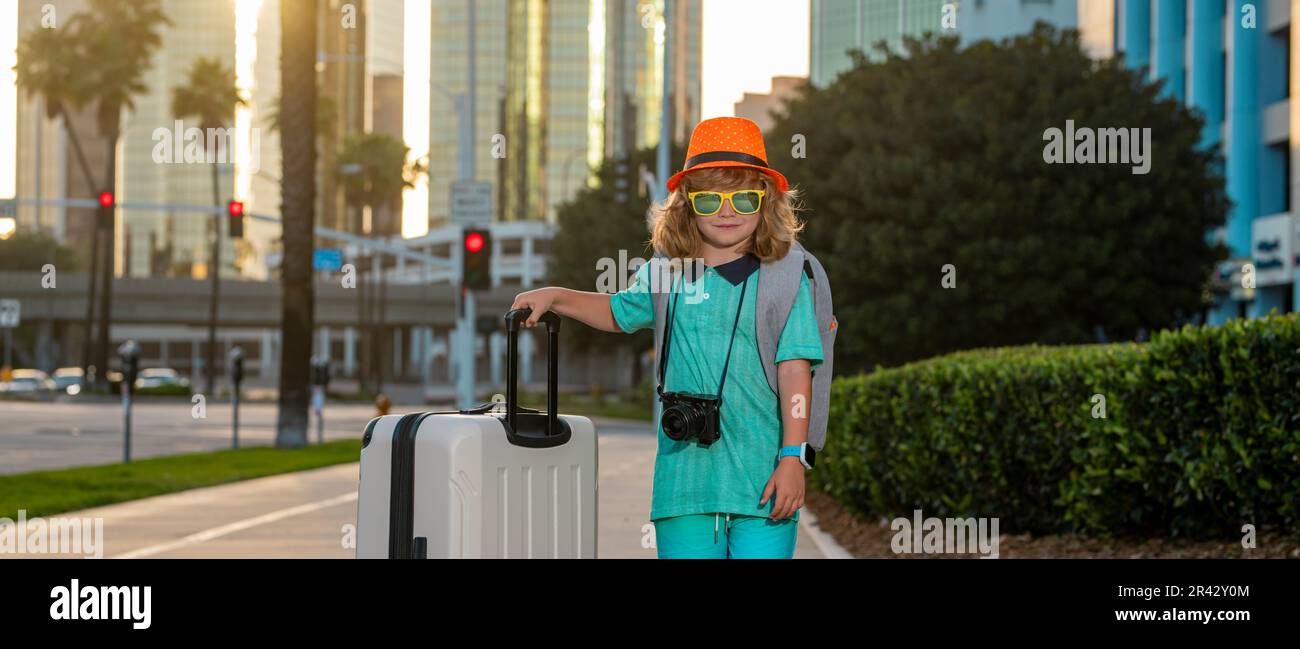 Child with suitcase going on vacation. Tourist boy on holiday, travel ...