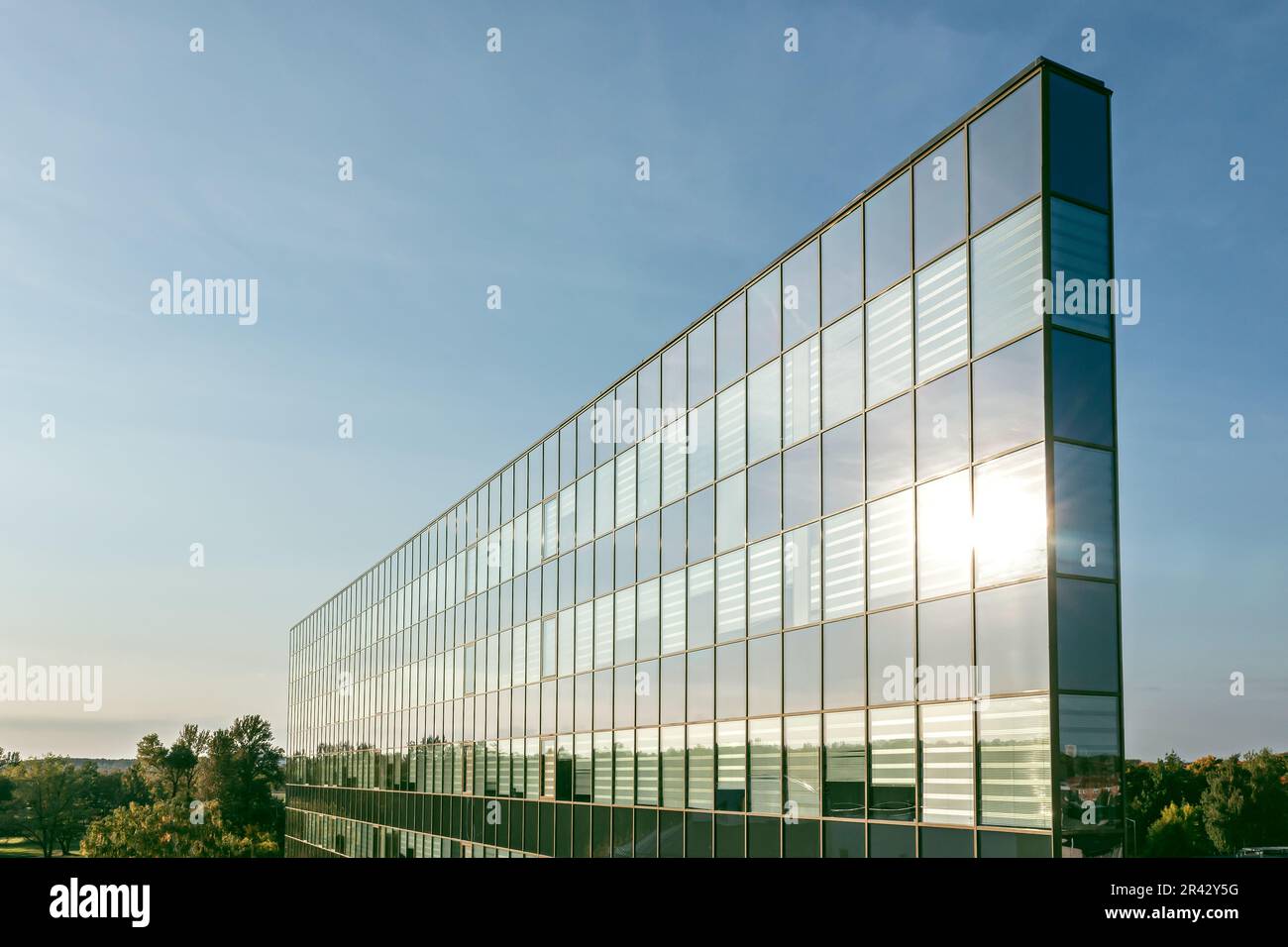 office building facade with sky reflections. modern glass building at ...
