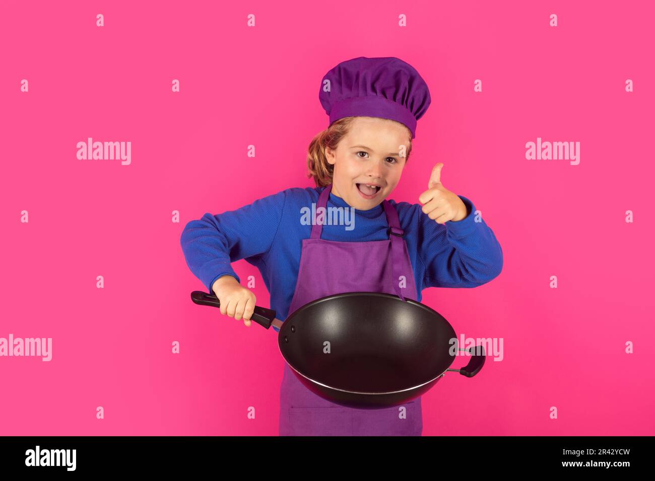 Kid cook with cooking pan. Child chef cook prepares food on isolated ...
