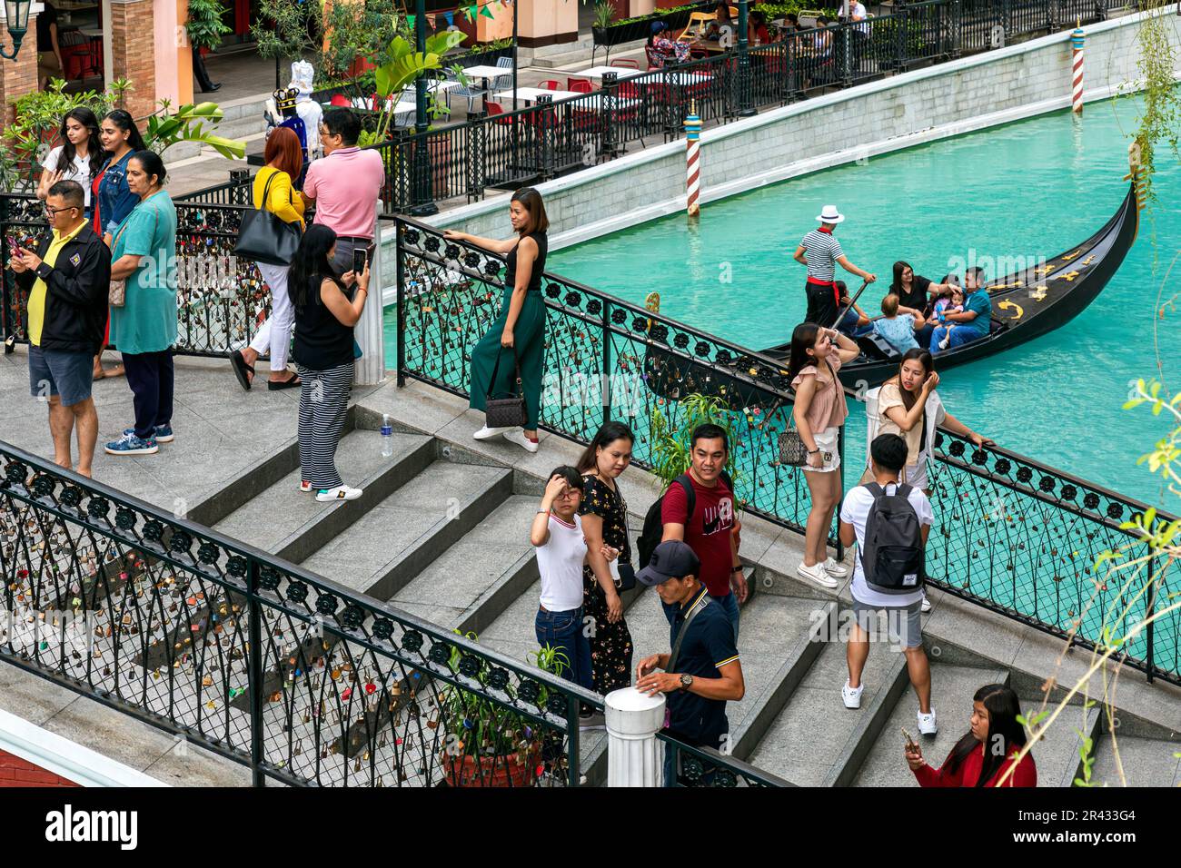 Shoppers taking pictures on bridge at Venice Grand Canal Mall, Taguig ...