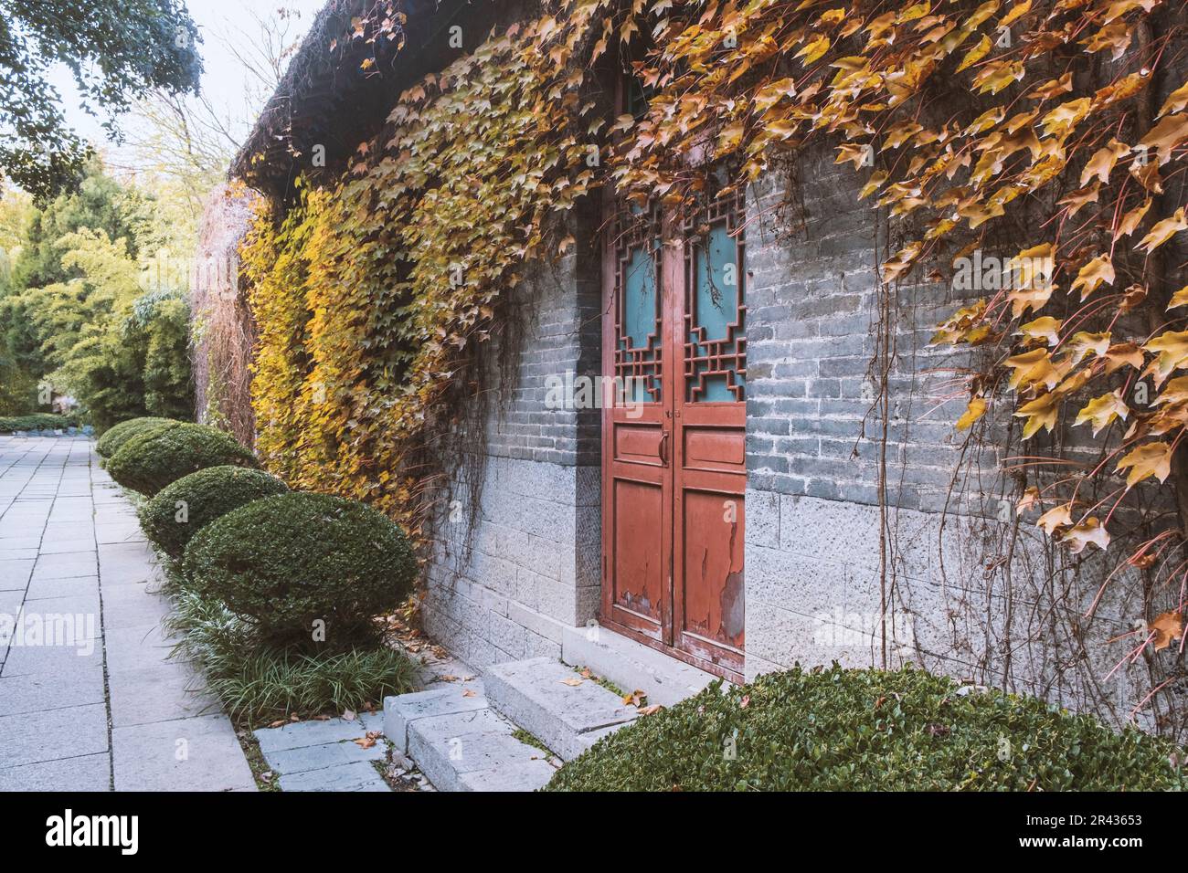 closed doors of old Chinese house by autumn Stock Photo - Alamy