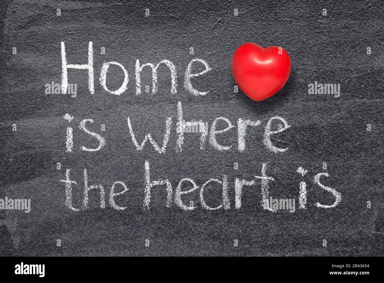 Home is where the heart is proverb written on chalkboard with red heart ...