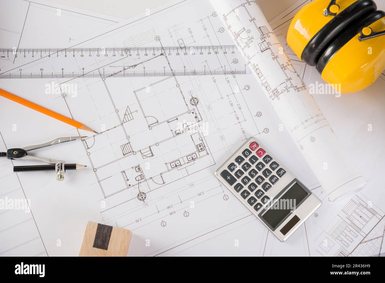 Top view of house plan blueprint paper with repair tools on table desk ...