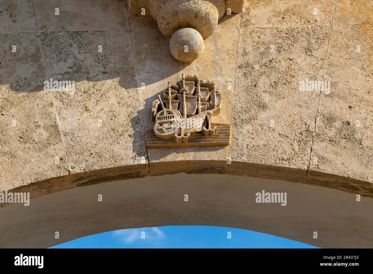 Stonework detail of Spanish galleon sailing ship on arch of city wall ...