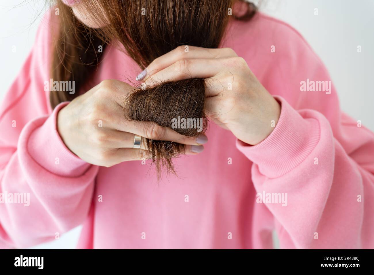 The concept of split ends, unhealthy hair. Close up portrait of ...