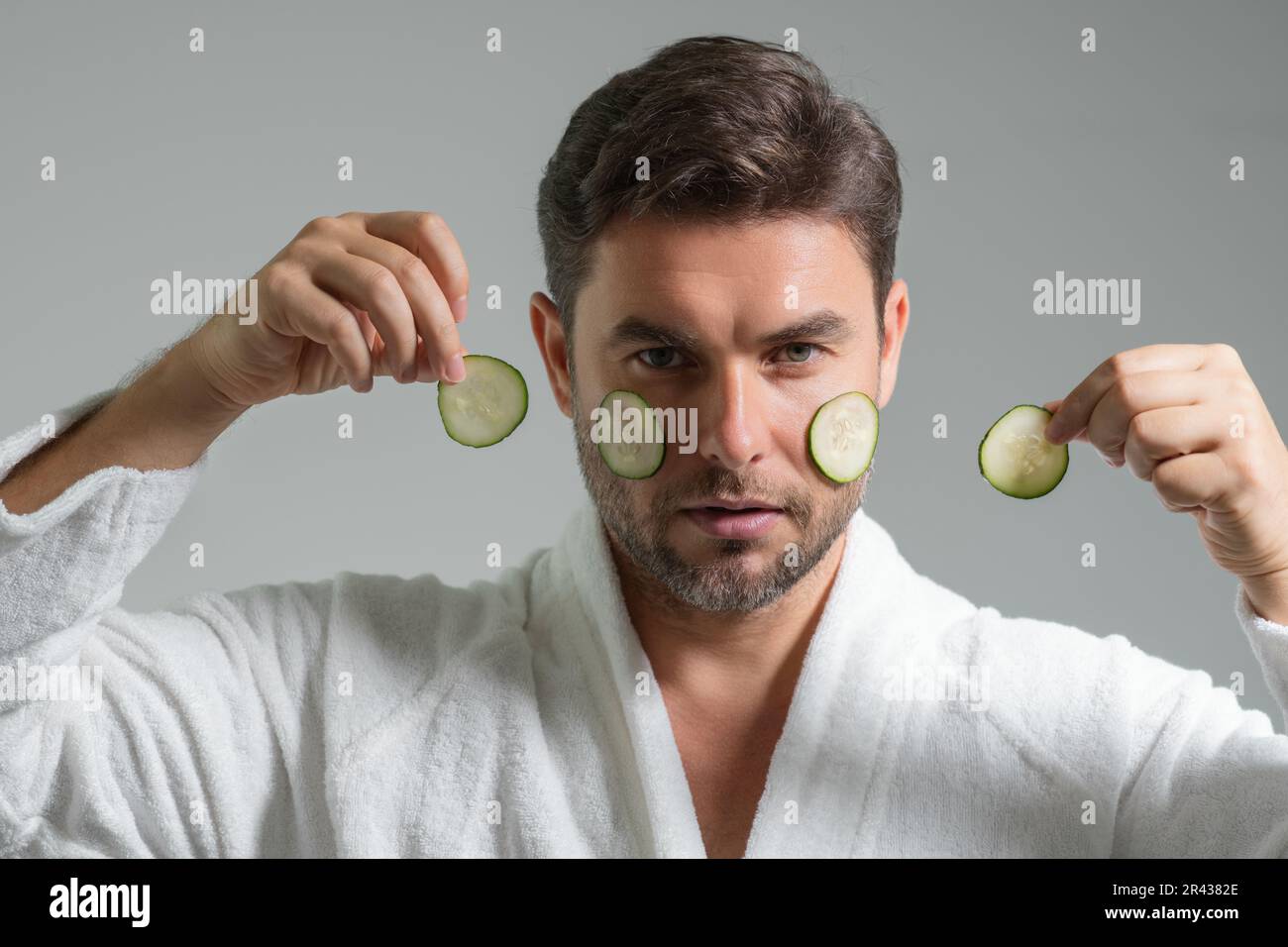 Beauty man with cucumber mask. Cucumber for cosmetics skin mask. Facial ...