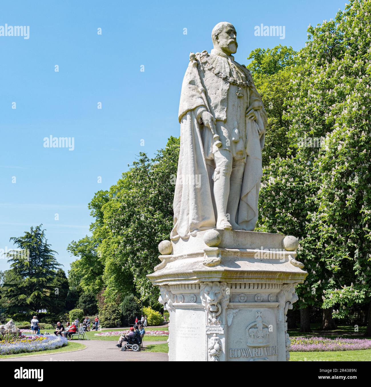 A Portland stone statue of King Edward VII standing proudly on a plinth ...