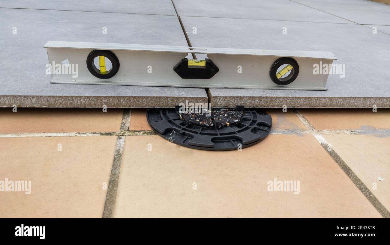 spirit level on floor tile with Pedestal Support with integrated slope ...