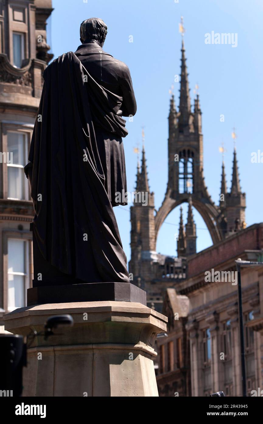 Statue of George Stephenson with St Nicholas cathedral behind ...
