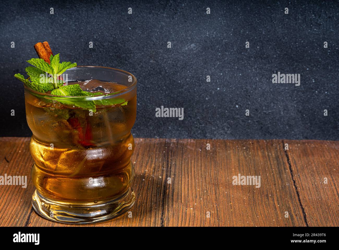 Autumn spicy booze alcohol drink, Tangerine Whiskey Smash cocktail with ...