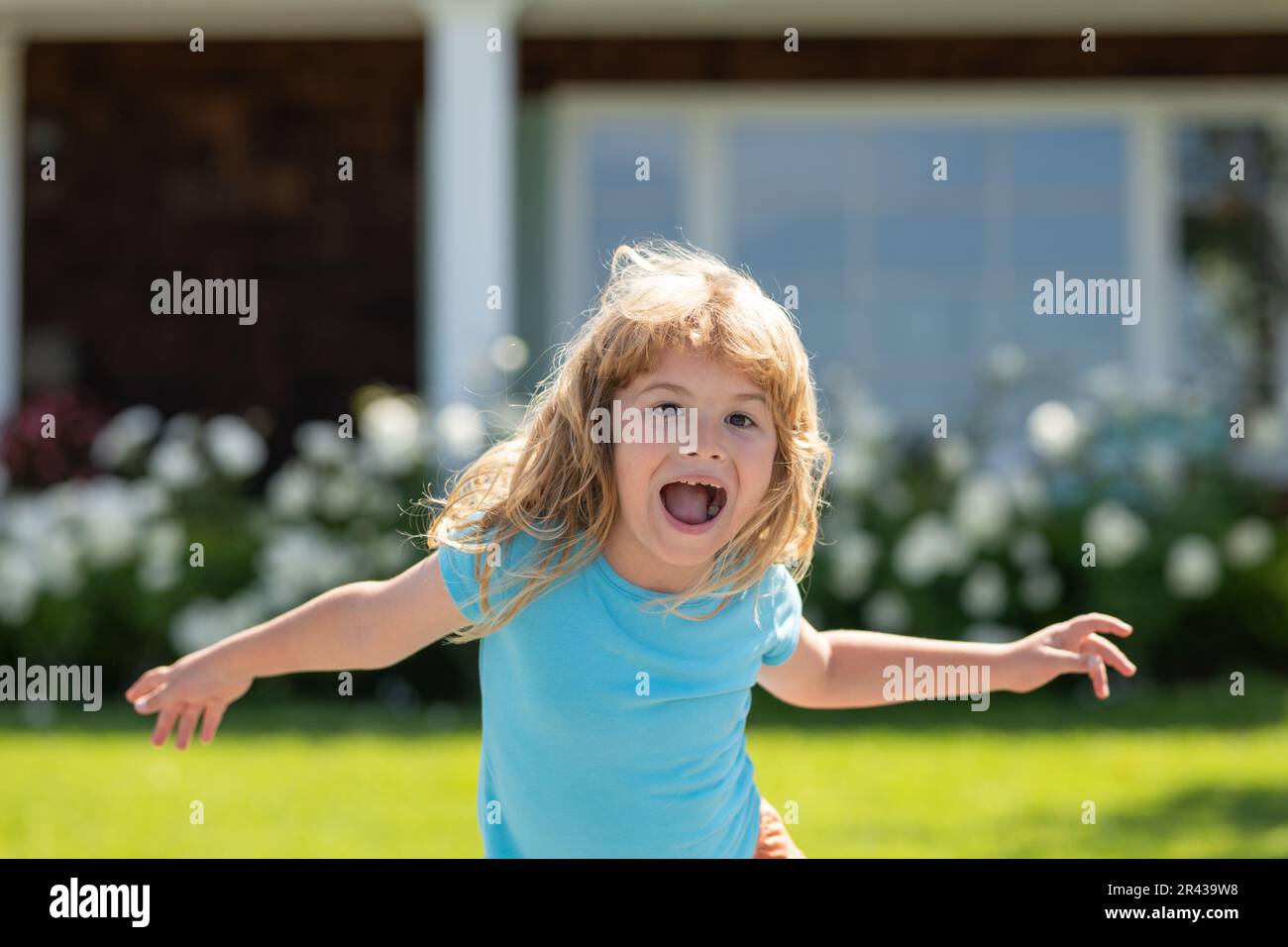 Little child play on summer backyard. Lifestyle closeup portrait of ...