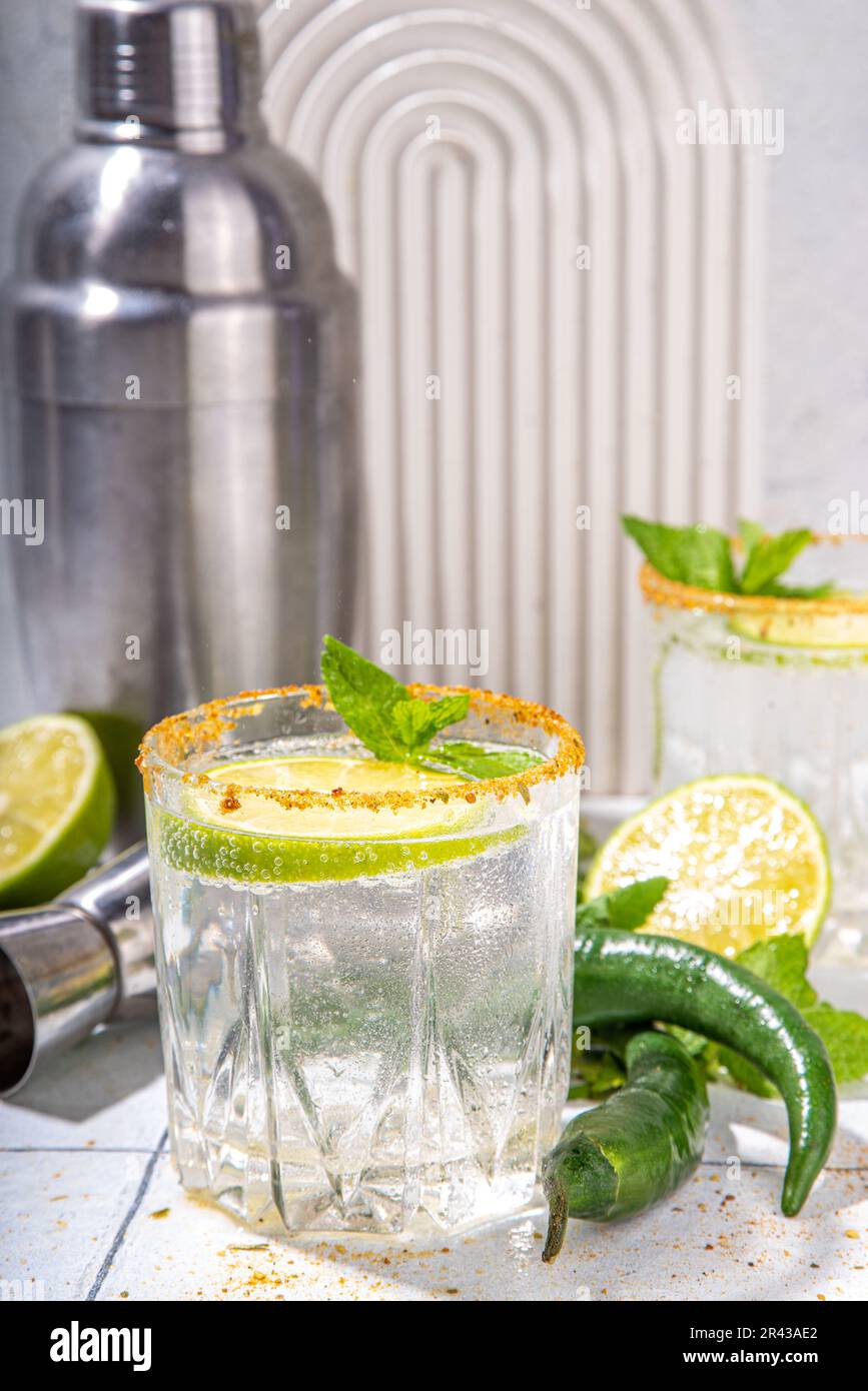 Spicy margarita or tequila cocktail with lime, chilli hot pepper and ...