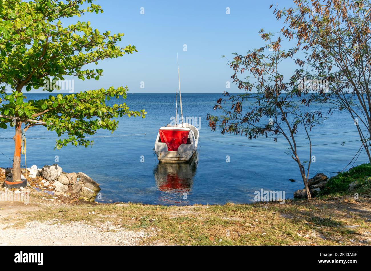 Small sailing boat at moorings in calm sea, Gulf of Mexico, Campeche ...