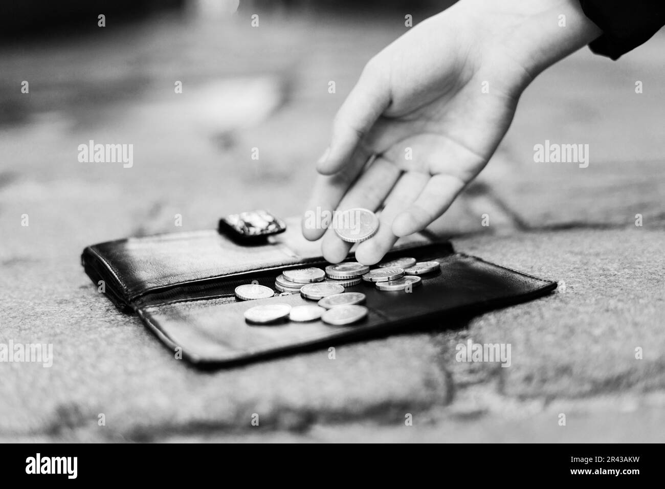 The wallet with coins on sidewalk street, forgotten money Stock Photo ...
