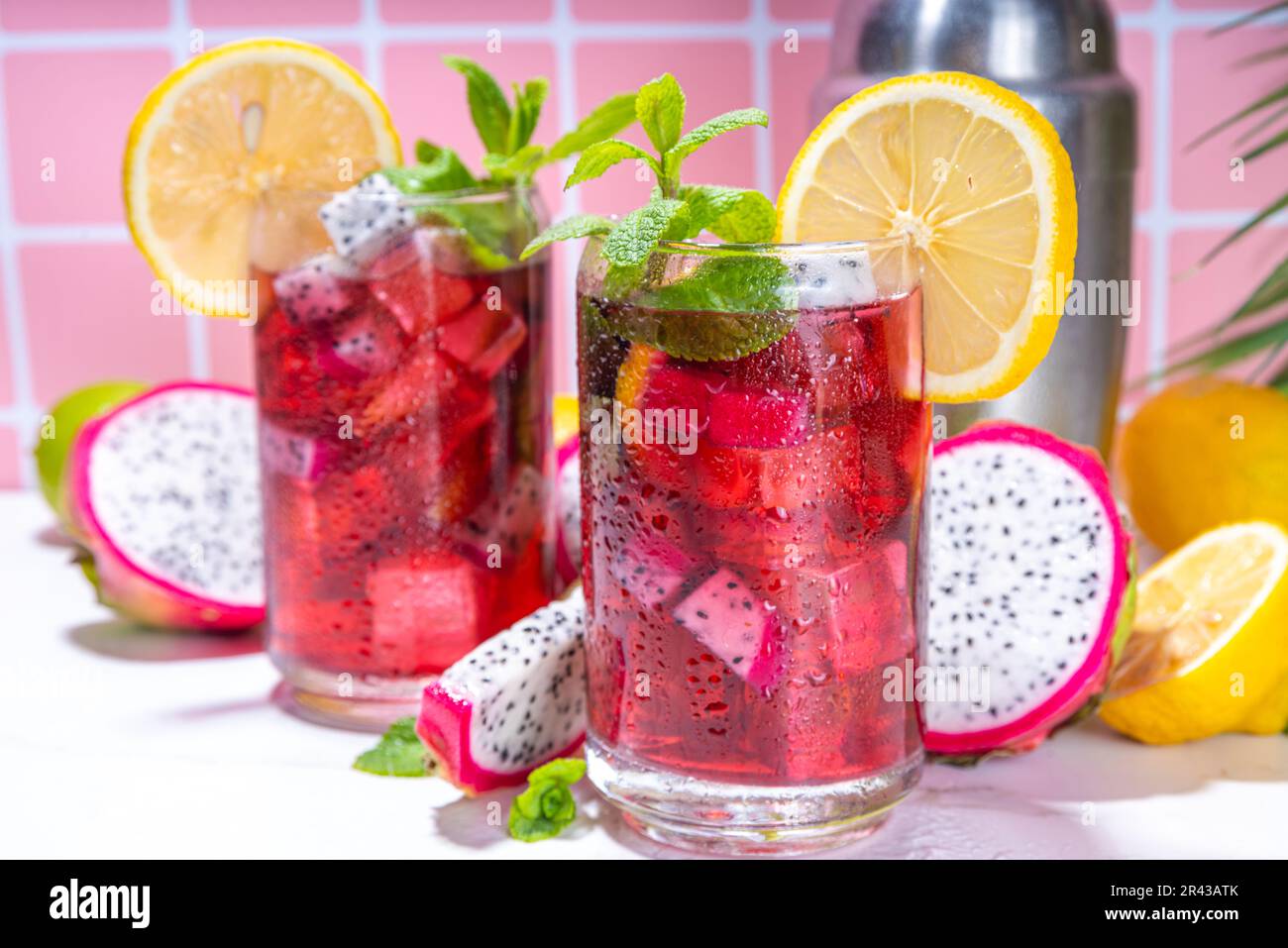 Sweet colorful tropical cocktail with pitaya or dragon fruit, lime and ...