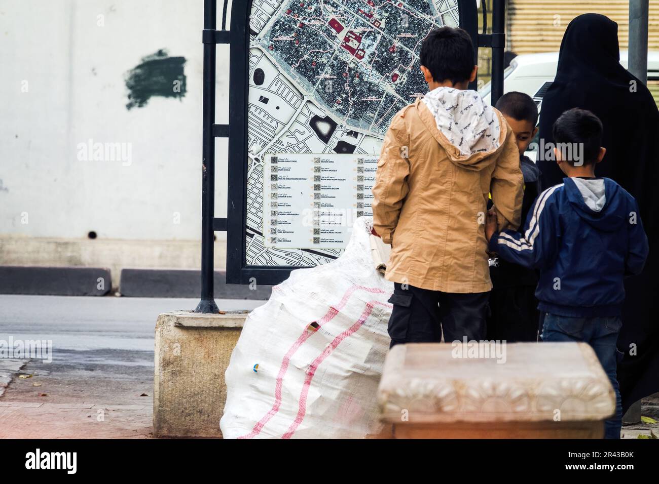 Shiraz, Iran- December 31, 2022: Street scene. Iranian woman with ...