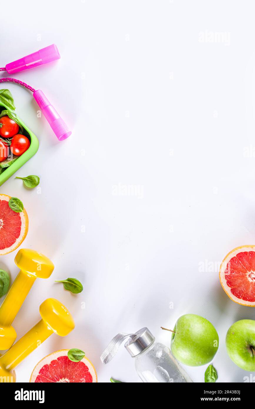 Fitness and healthy food lifestyle concept. Dumbbells, diet fruit and ...