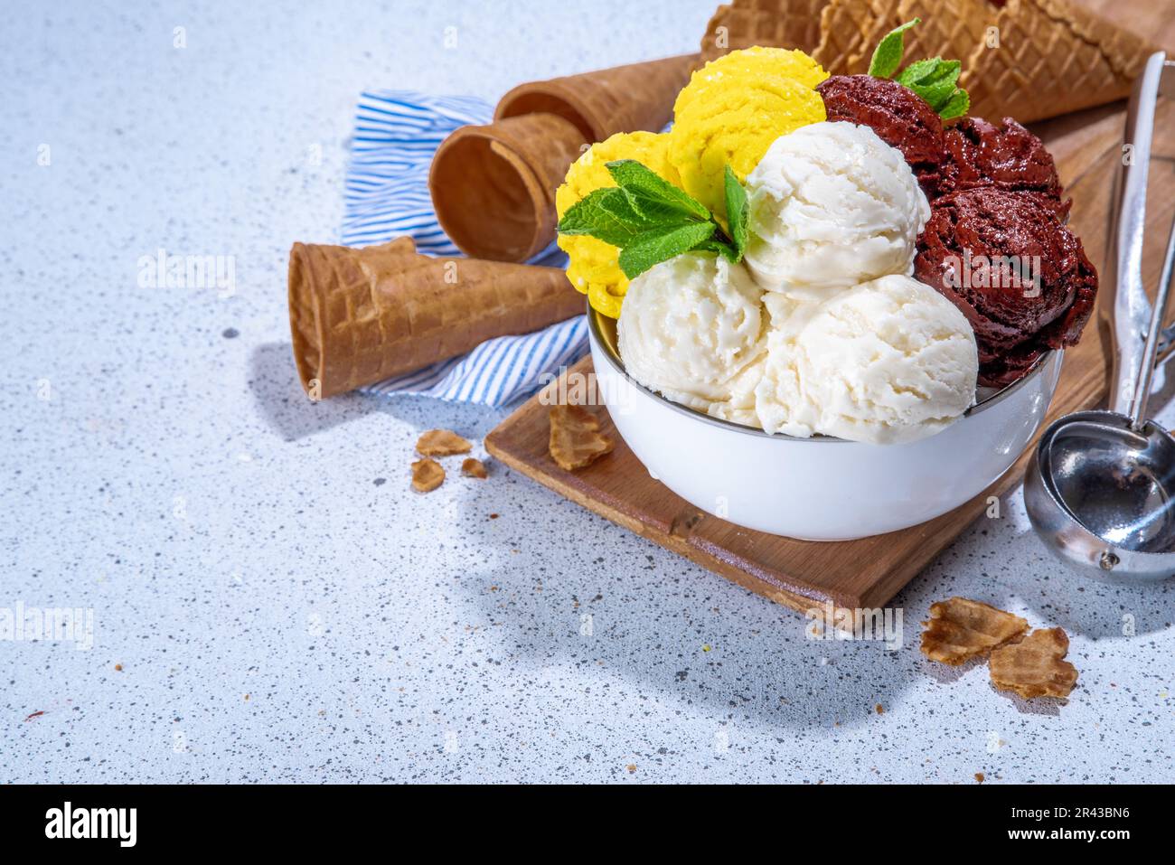 Lemon, chocolate and vanilla ice cream balls. Big bowl with ice cream ...