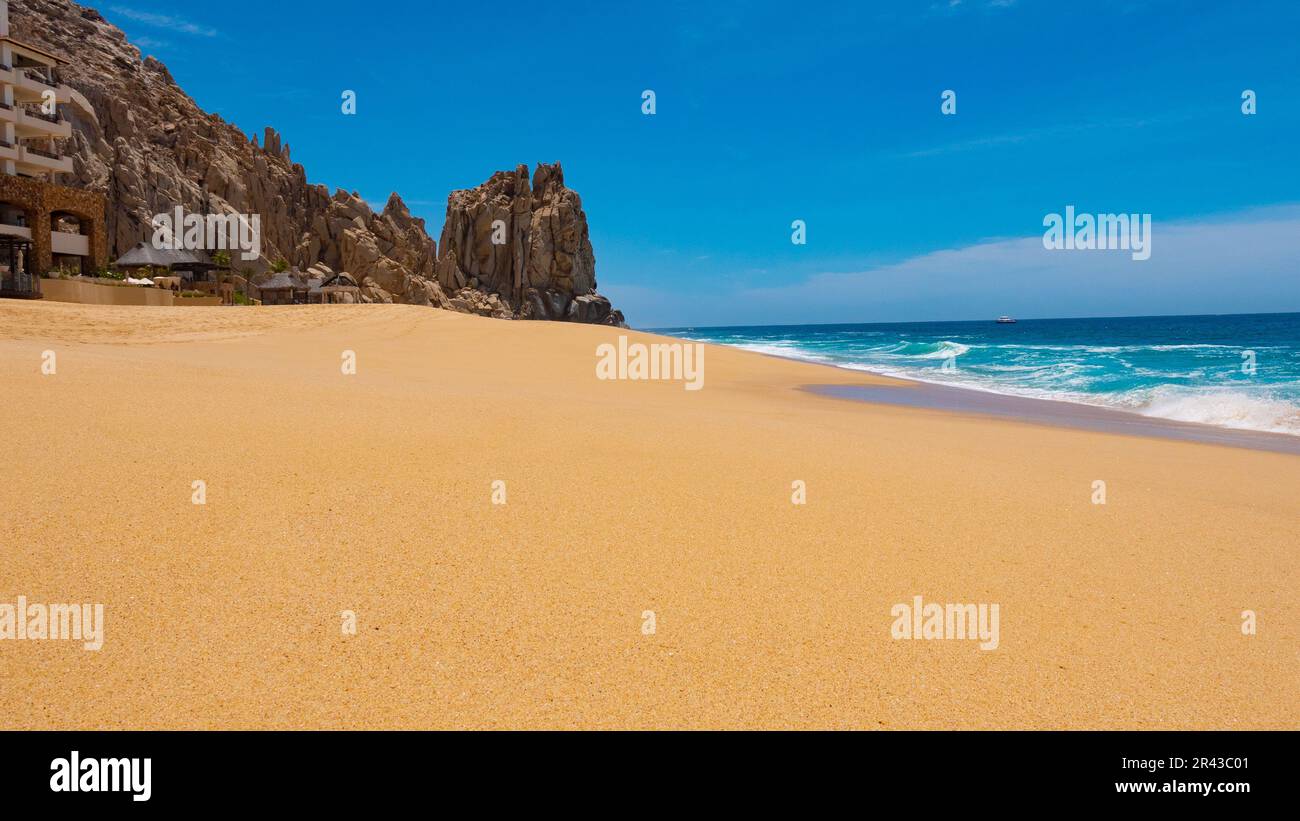 rocky sandy beach seaside with mountain. rocky beach seaside with water ...
