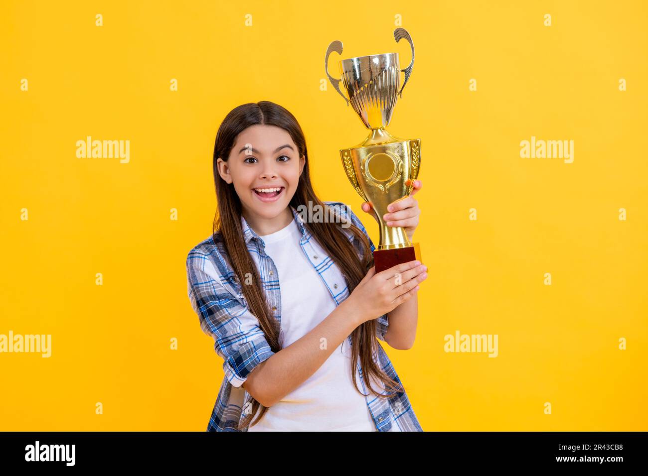 surprised teen girl accept award on background. proud teen girl with ...