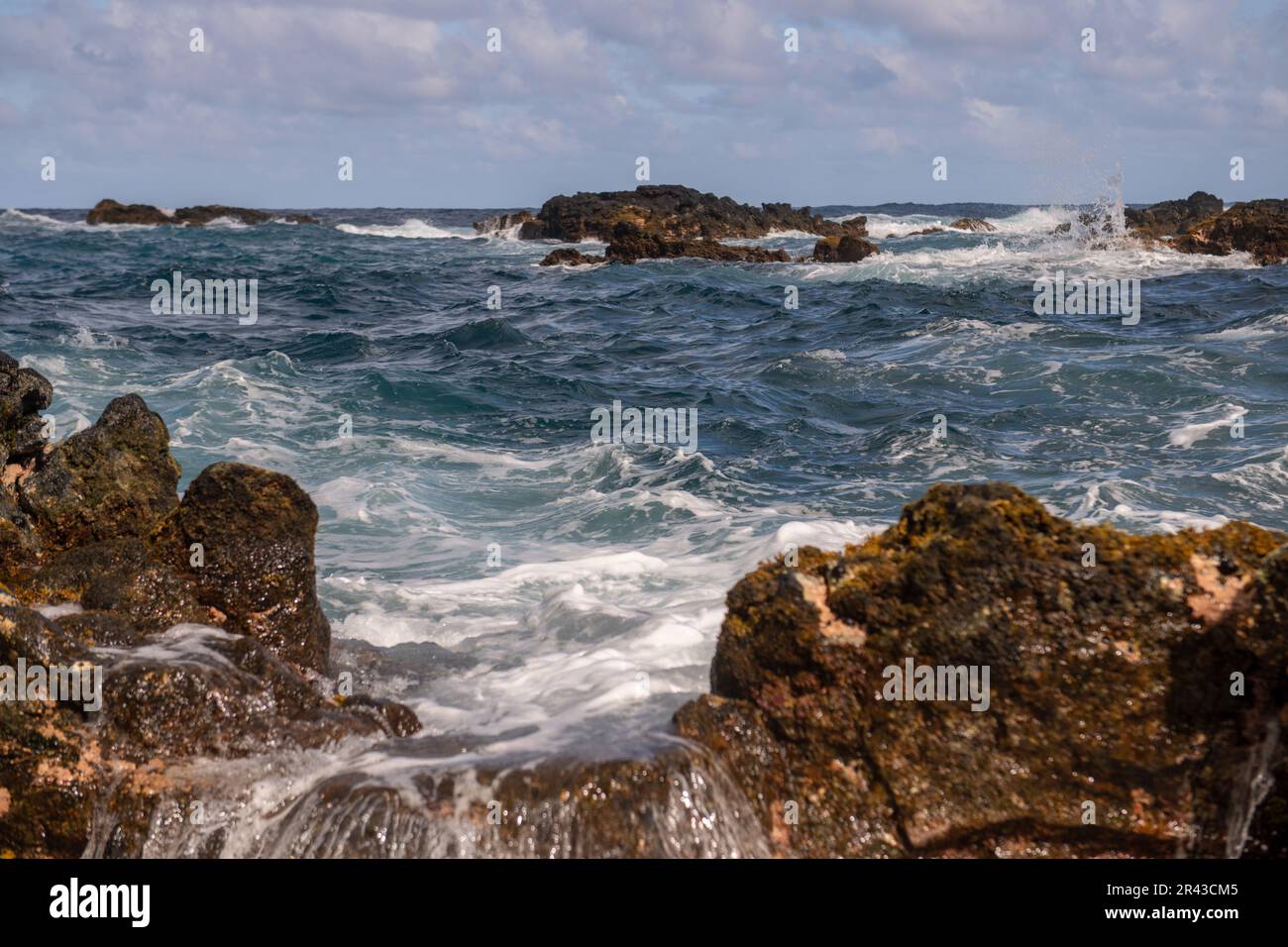 Splashing waves on the rock in the sea. Wave hit the stone in the ocean ...