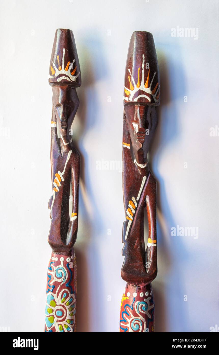 Traditional african wooden elongated figurines. Isolated over white ...