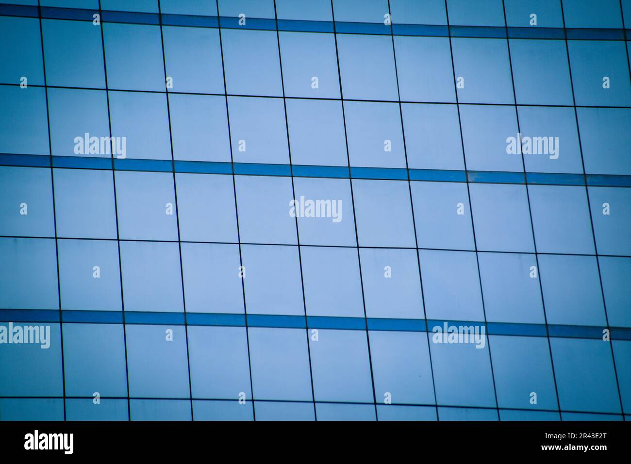 Blue glass windows of office building for background Stock Photo - Alamy