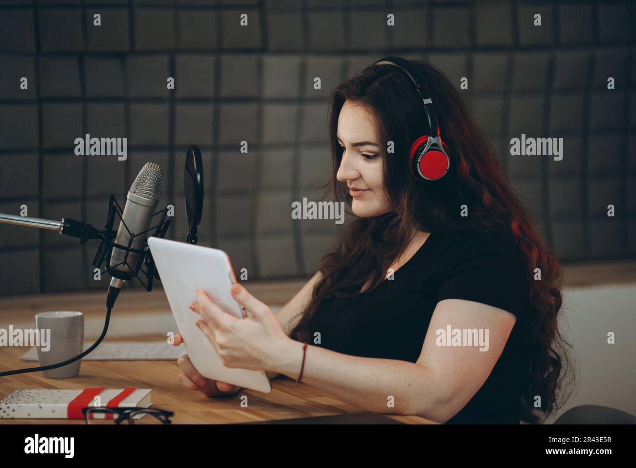 The female voice artist acting some role during the dubbing process in ...