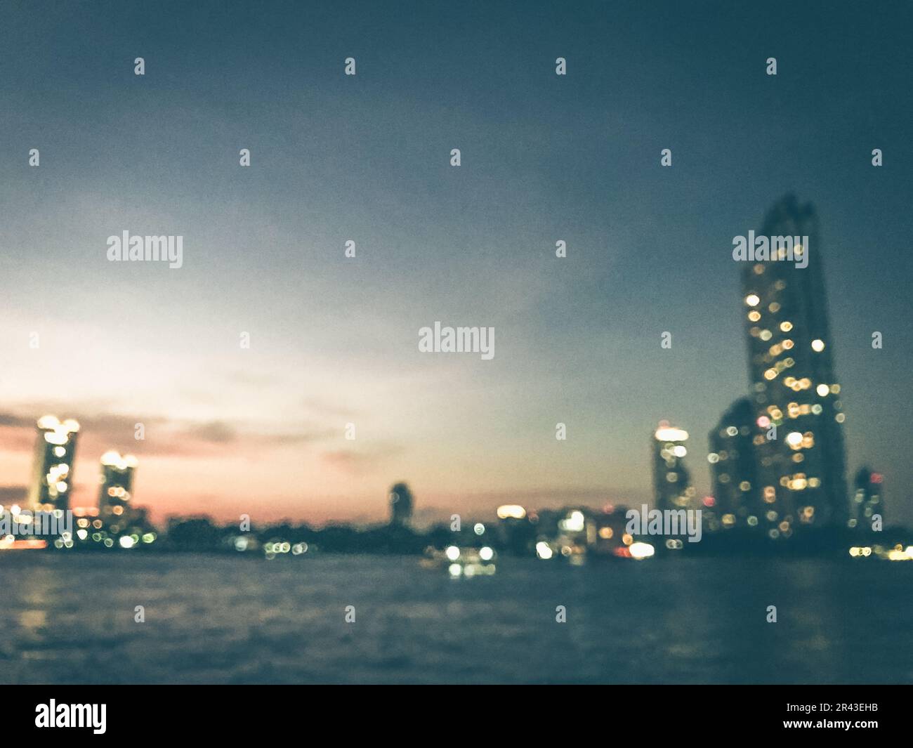 Blur of modern city building at night with reflection in water Stock ...