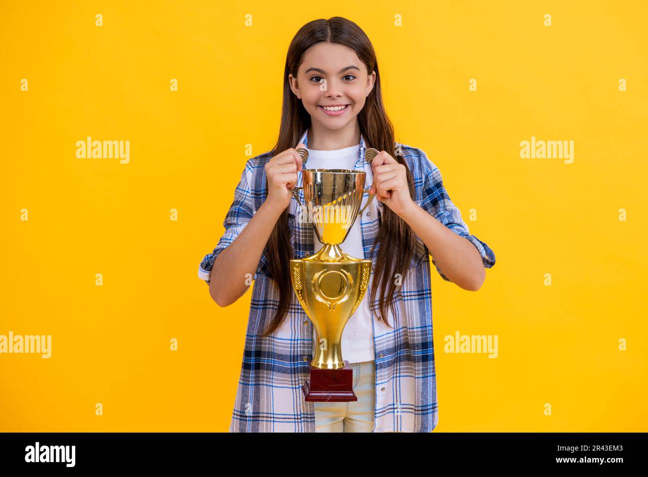 smiling teen girl receive award in studio. teen girl accept award on ...