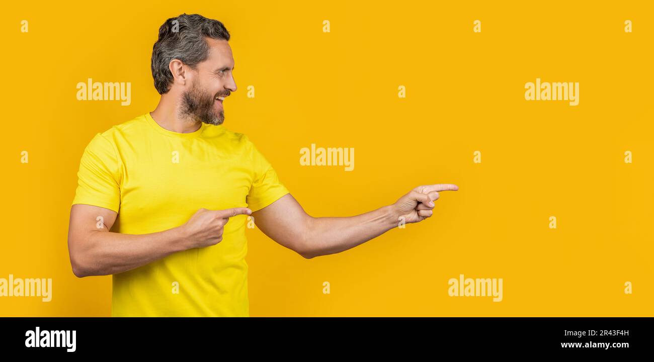 photo of happy man pointing at advertisement offer. man pointing at ...