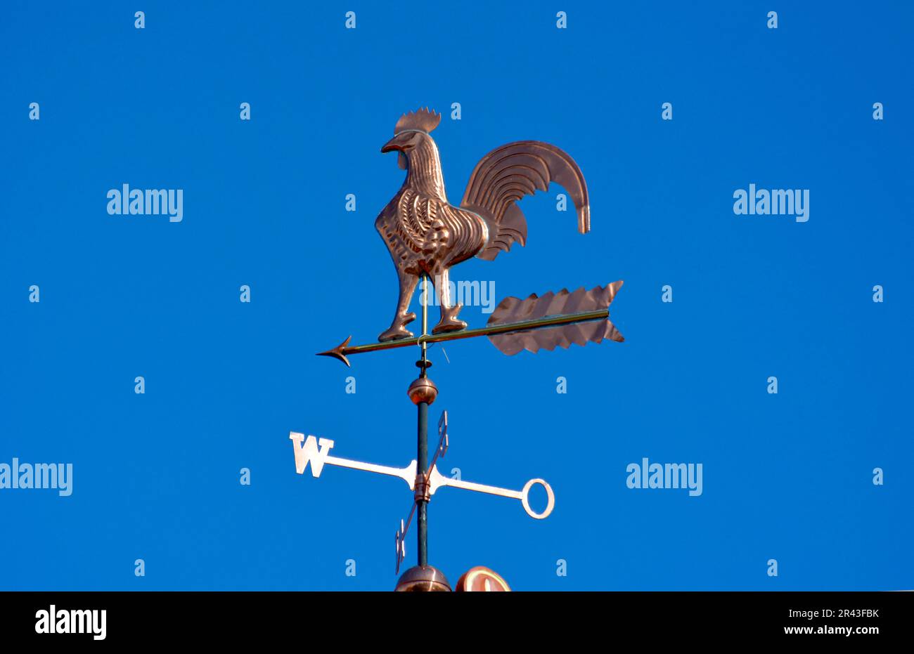 Sheet copper weathercock on house roof Stock Photo - Alamy