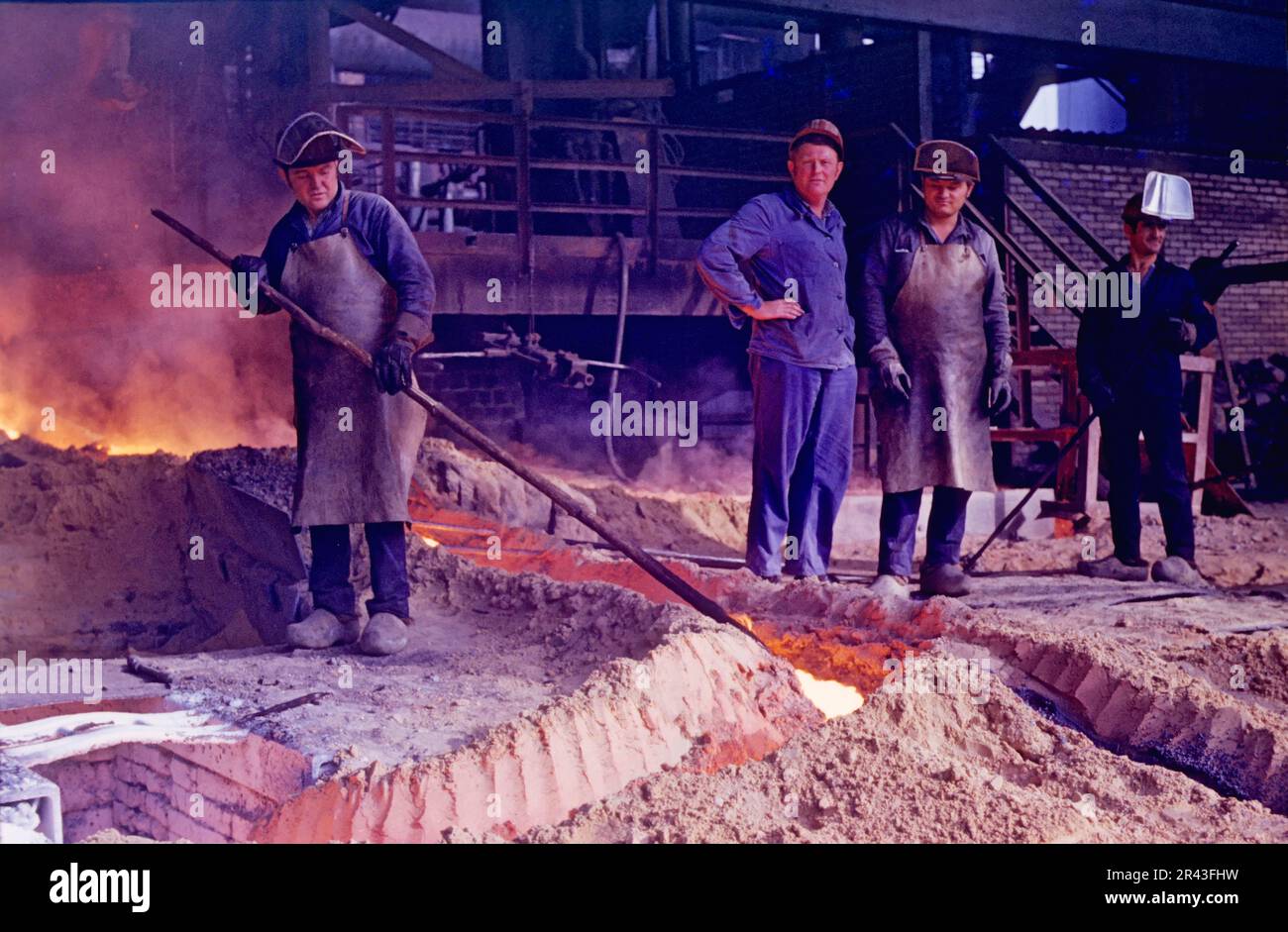 Steelworks, foundry with workers Stock Photo - Alamy