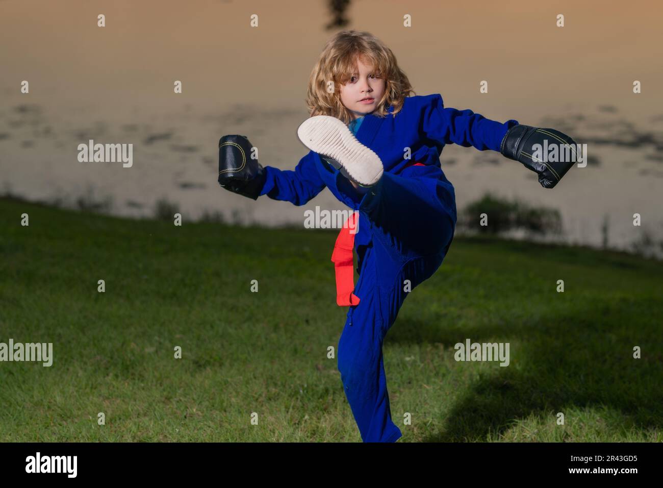 Kid boy practicing box outdoor. Sport karate kids. Little boy in kimono ...