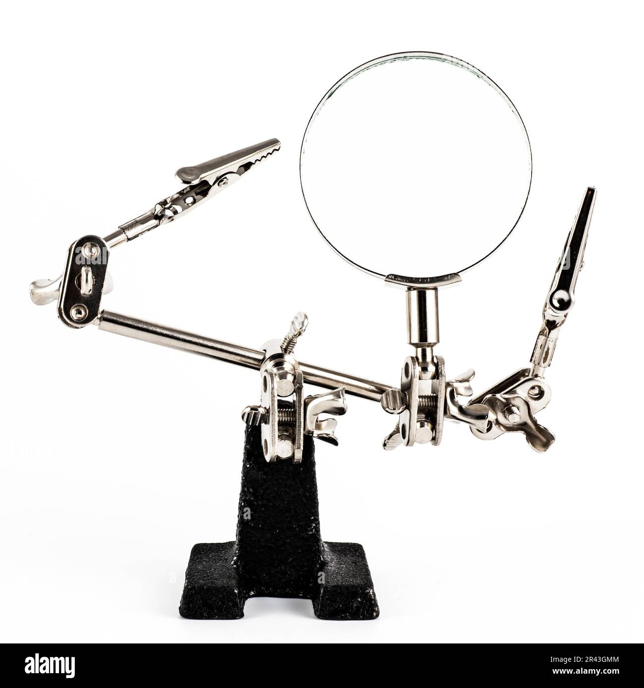 Magnifier with three handles used for watch repairs Stock Photo - Alamy