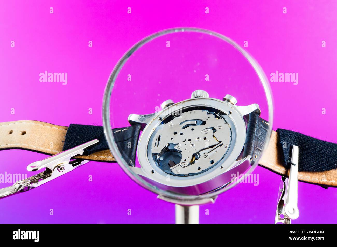 Elegant watch repaired using a magnifier with three handles Stock Photo ...
