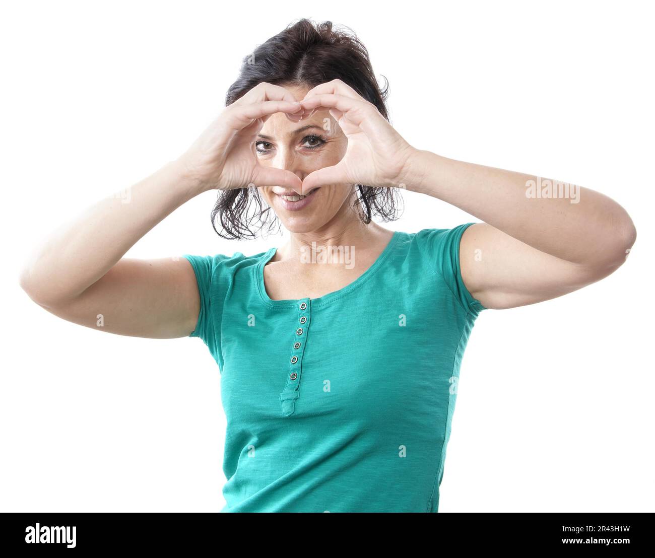 mature woman forming heart shape with her hands Stock Photo - Alamy