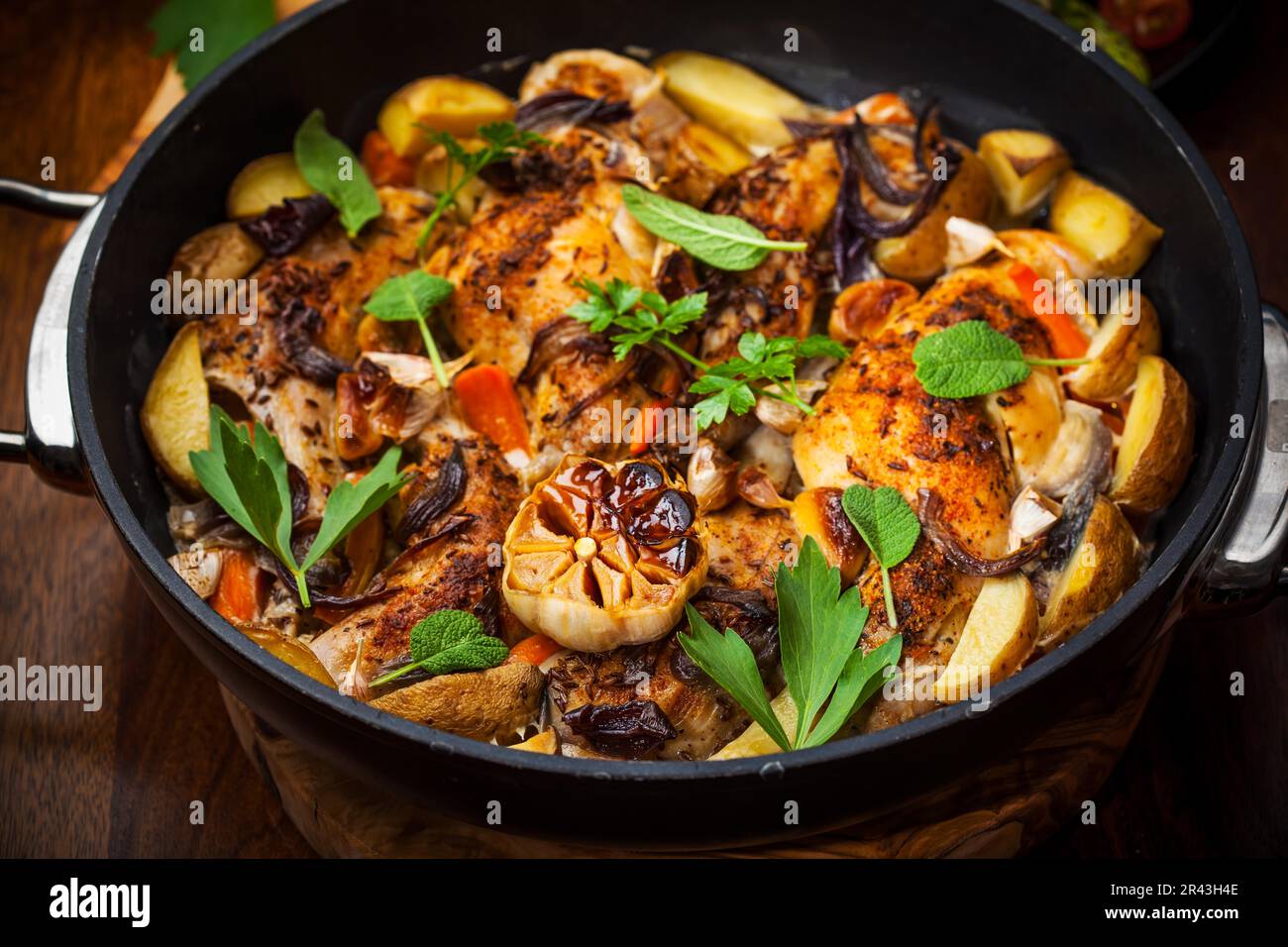 Roasted roasted rabbit on vegetables in pan Stock Photo - Alamy