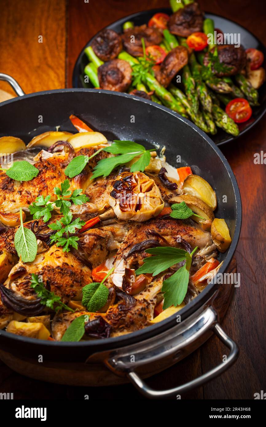 Roasted roasted rabbit on vegetables in pan Stock Photo - Alamy