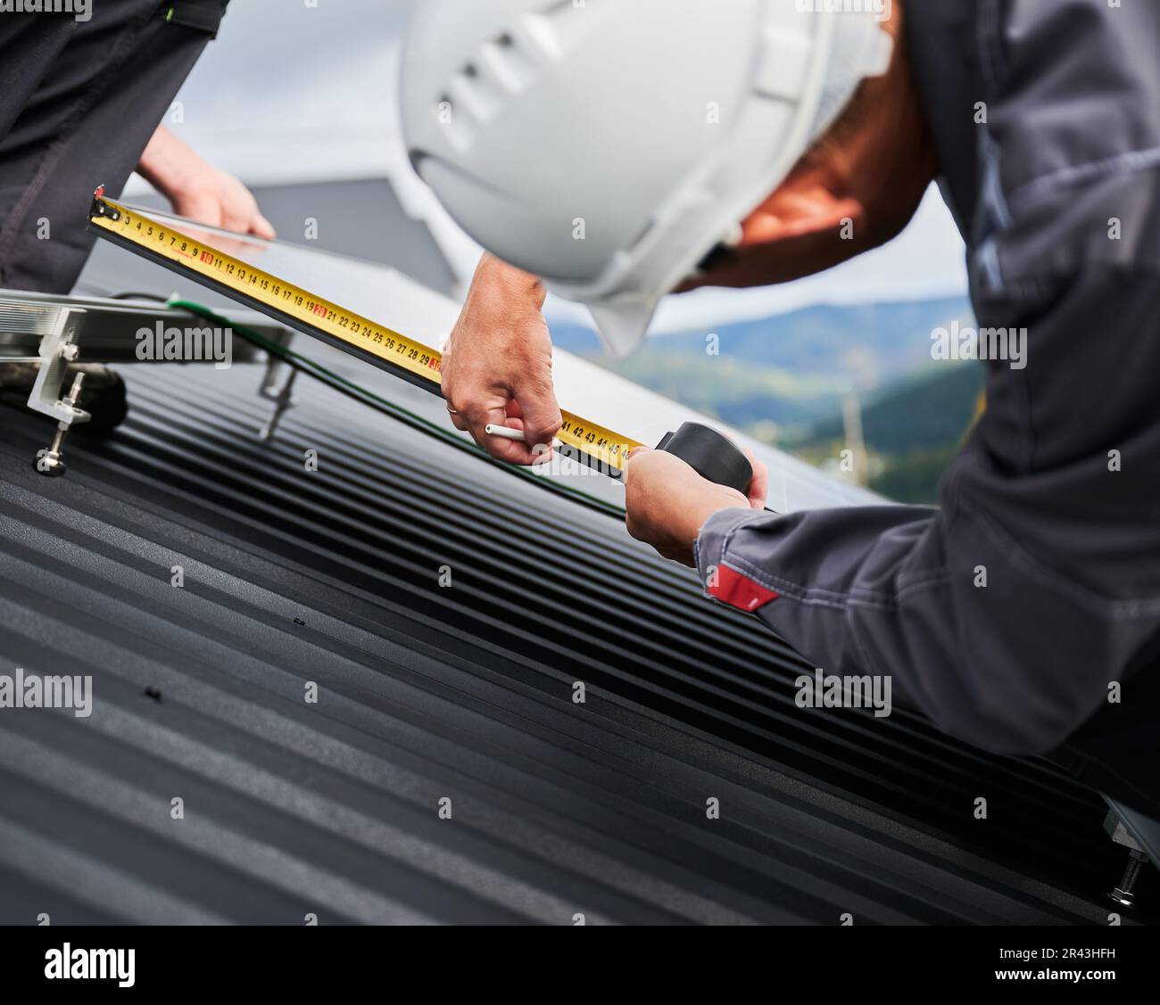 Back view of competent technician making measurements for exact ...