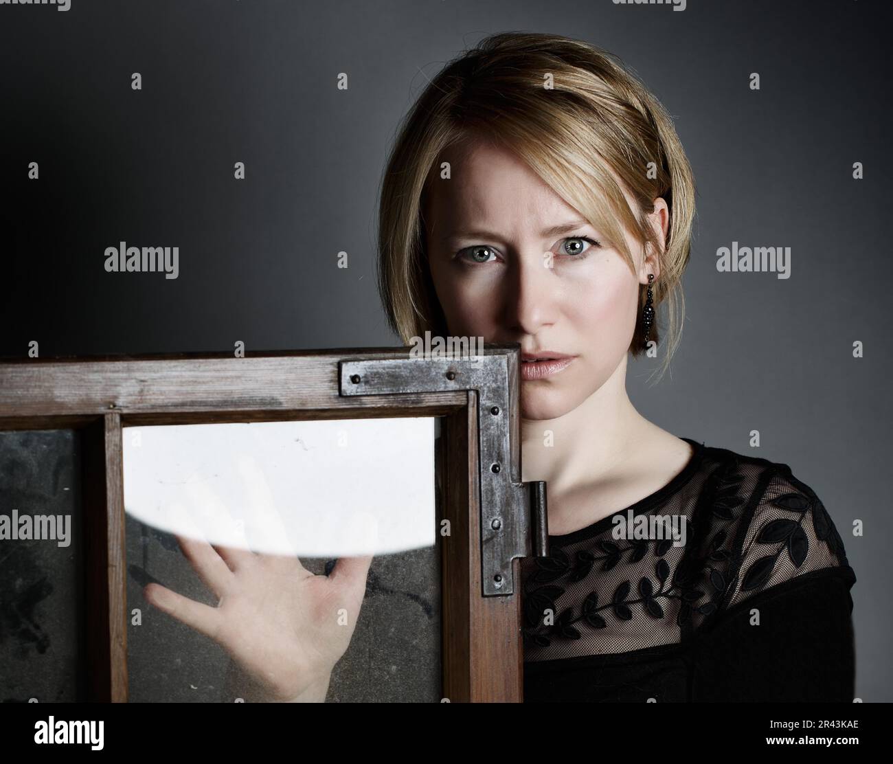 Portrait of a Blonde Woman with Old Window Frame Stock Photo - Alamy